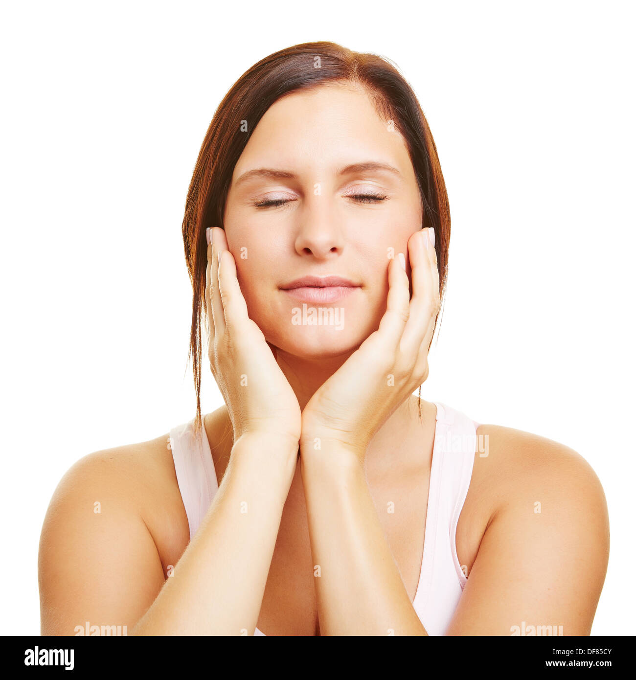 Relaxed young woman using skin lotion for her face Stock Photo - Alamy