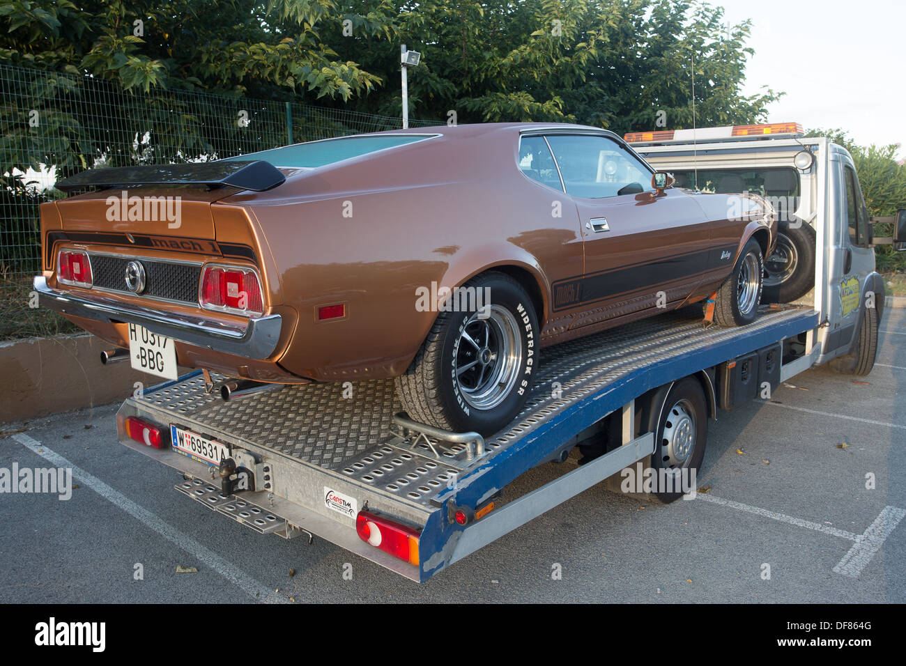 1970's brown ford mustang mach 1 recovery truck Stock Photo - Alamy