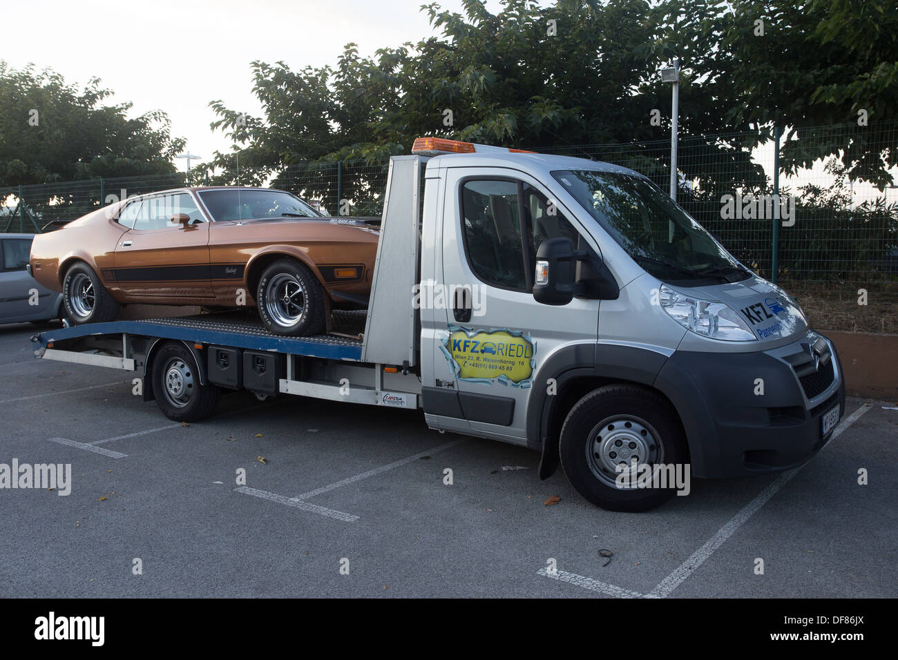 1970's brown ford mustang mach 1 recovery truck Stock Photo - Alamy