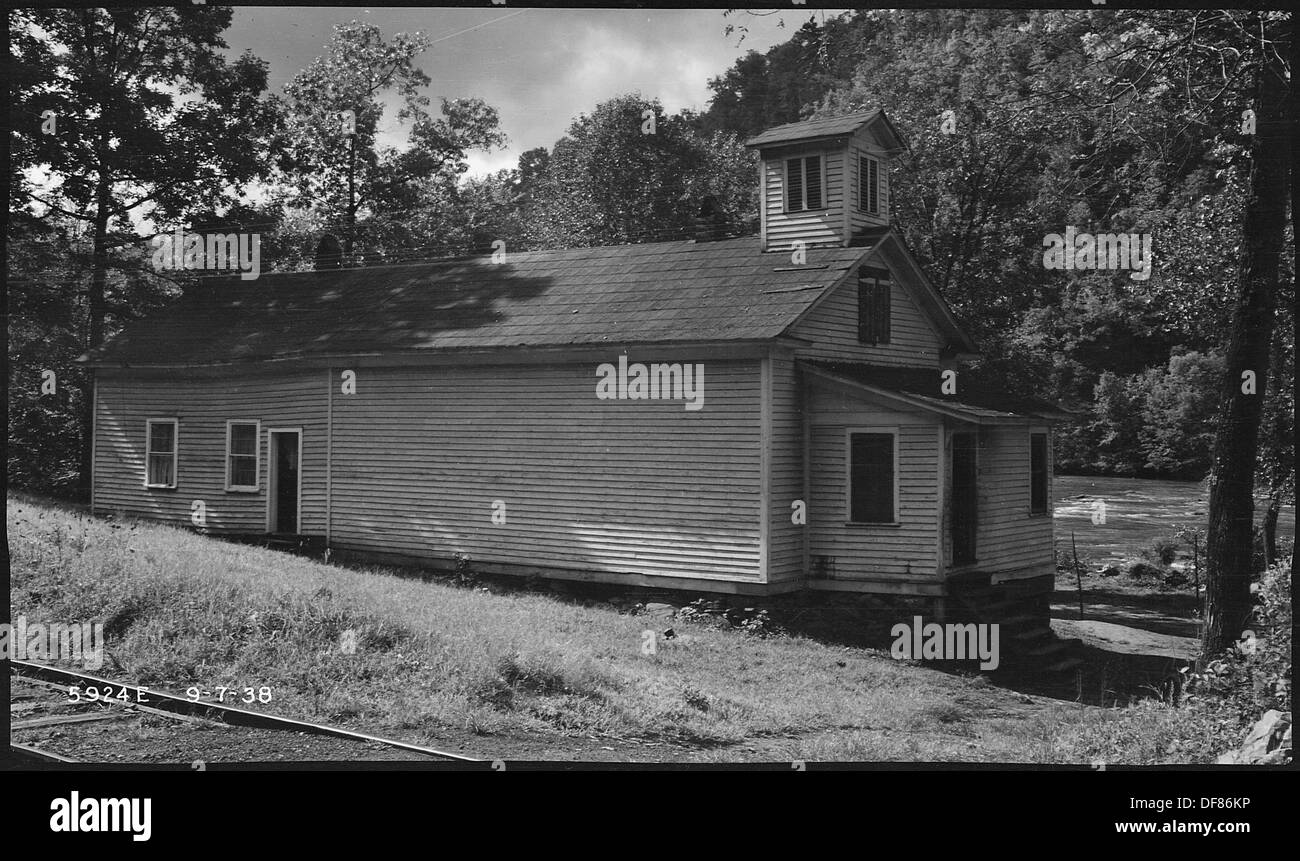 This historical photograph depicts a school, likely from the early 20th ...