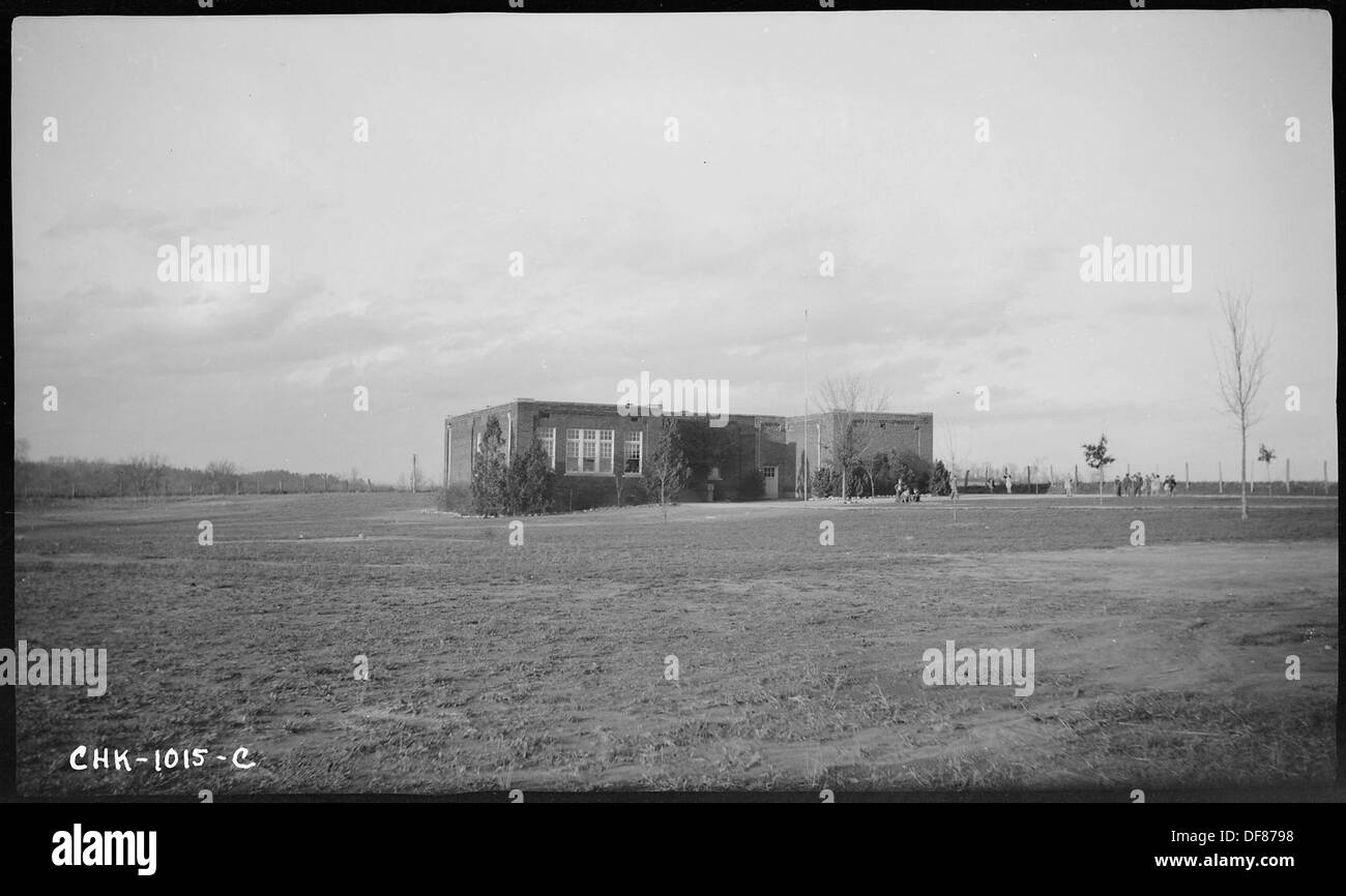 A photograph of a traditional school house, illustrating early ...