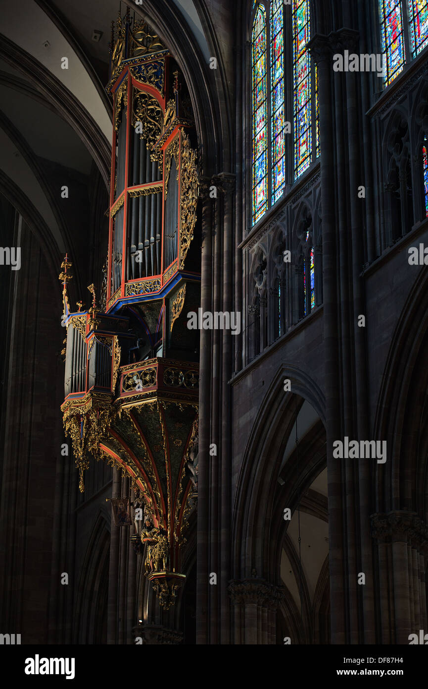 Inside the Cathedral of Strasbourg. Large colored Organ hanging on a ...