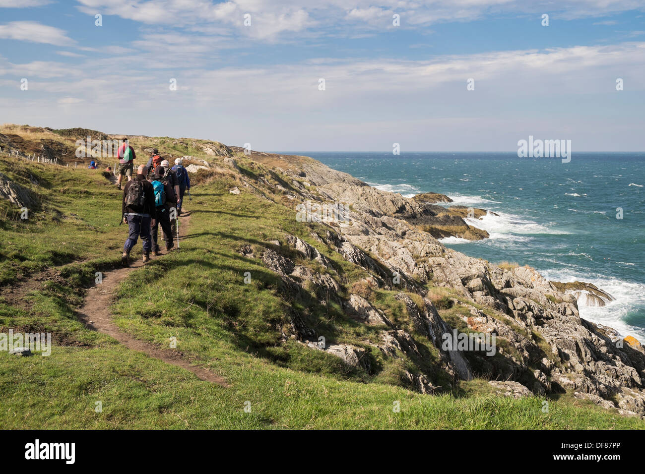 Walkers on the isle of anglesey coastal path north wales hi-res stock ...