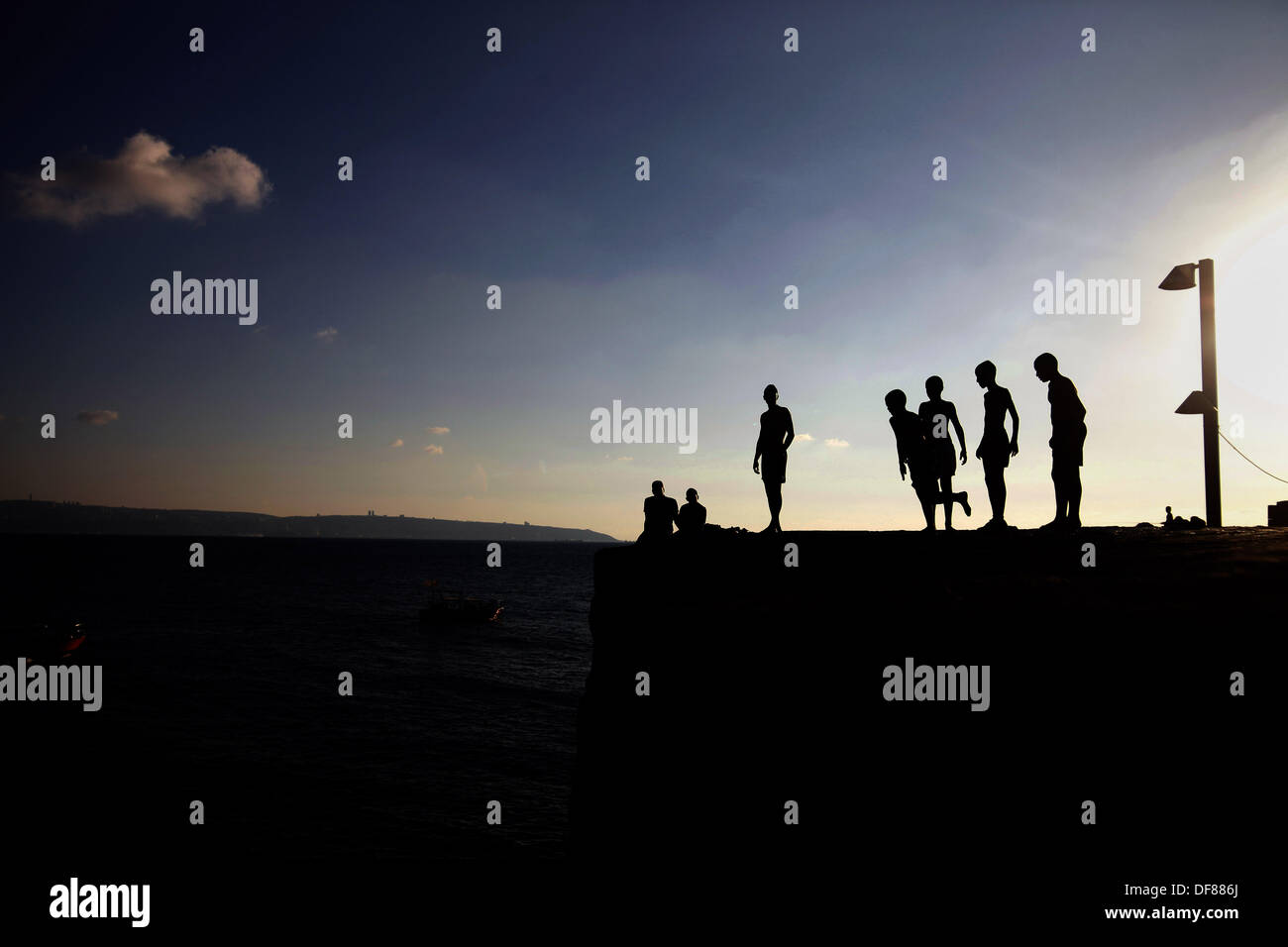 Akko, Akko, Palestinian Territory. 29th Sep, 2013. Tourists leap into ...