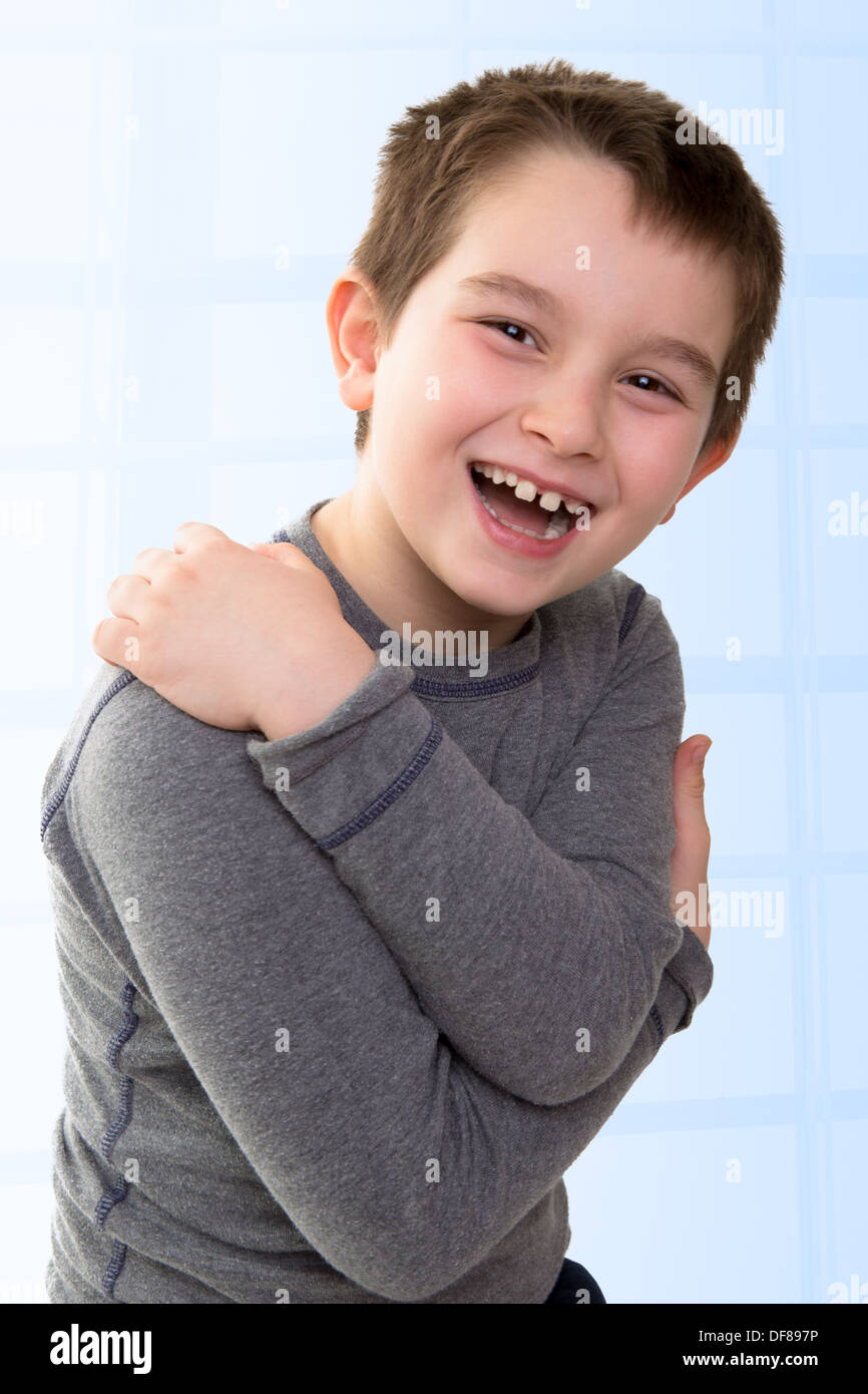 Young kid expressing his happiness while his arms closed, body language ...