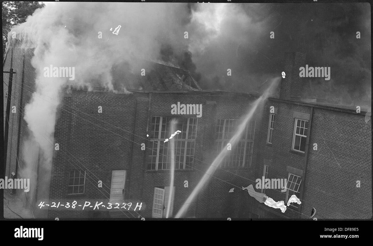 The image shows the roof of Sheffield High School on fire, a dramatic ...
