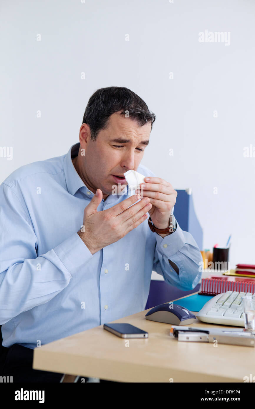 Office worker sneezing hi-res stock photography and images - Alamy