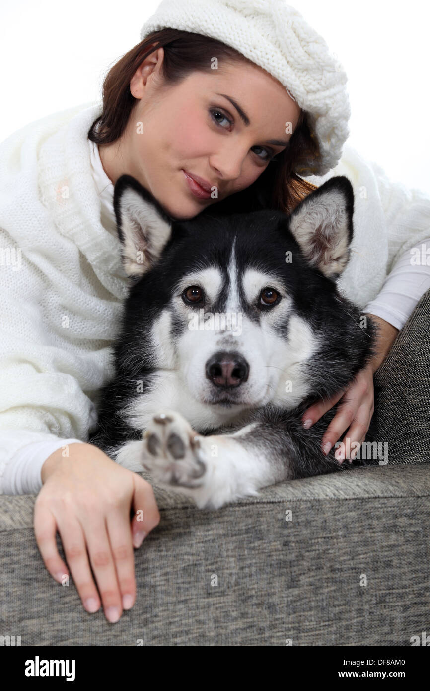 Portrait of a young woman with husky Stock Photo - Alamy