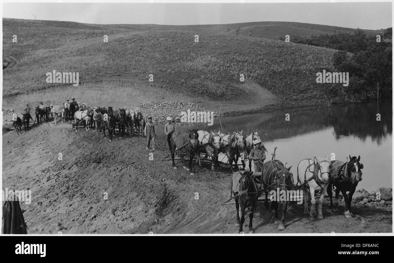This historical image shows six teams of four-horse hitches being ...