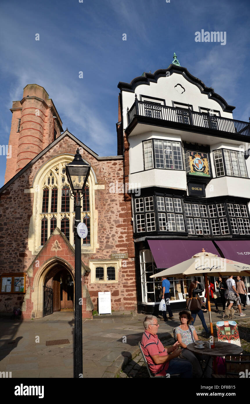 Customers at an outdoor café in the Cathedral Yard in Exeter, Devon ...