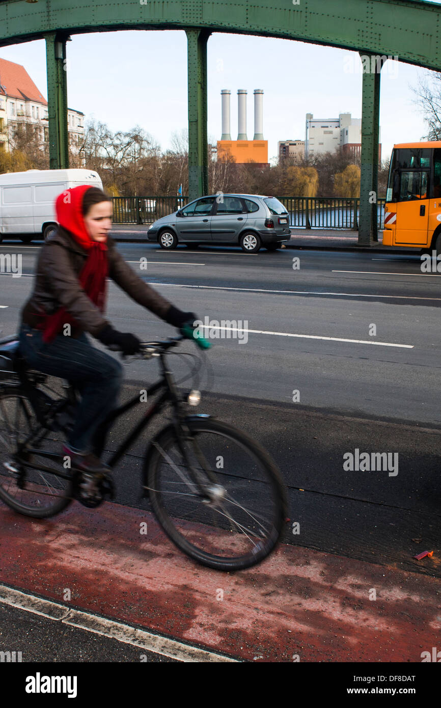 Woman riding a bicycle on Schlossbrucke (Palace Bridge). Berlin ...