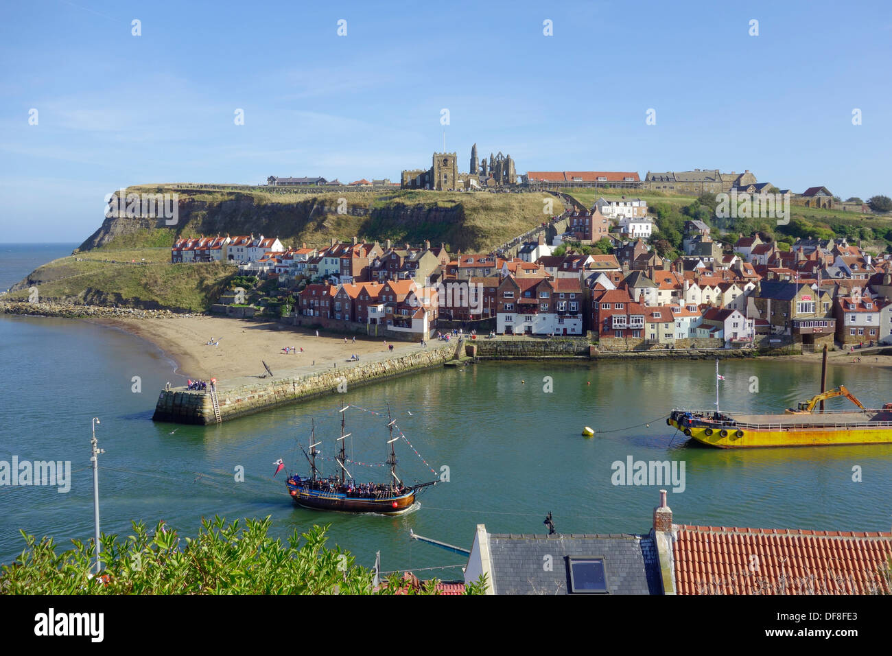 Whitby harbour with cottages on the east side of town and St Mary's ...