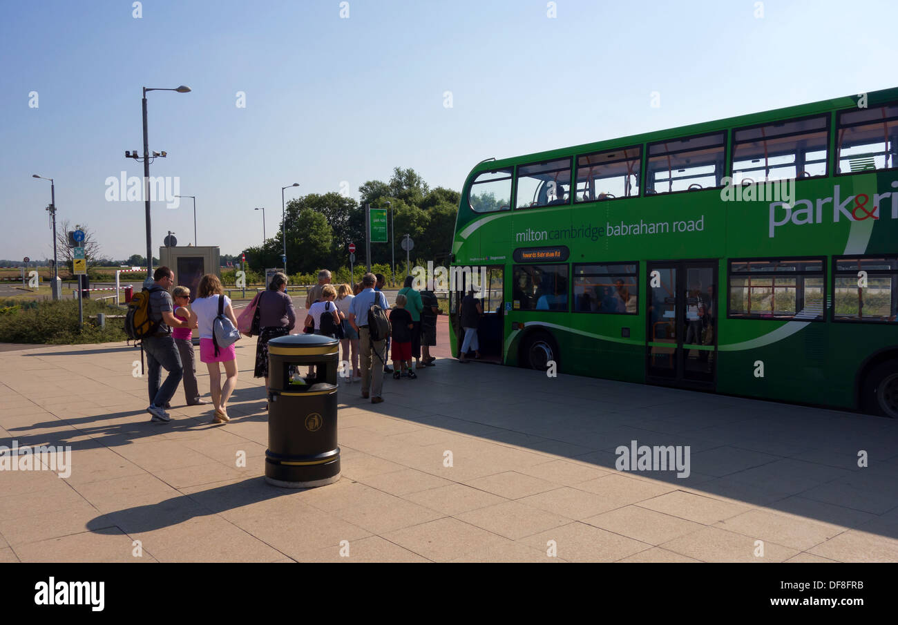 Passengers queuing for park and ride bus Milton Stock Photo - Alamy