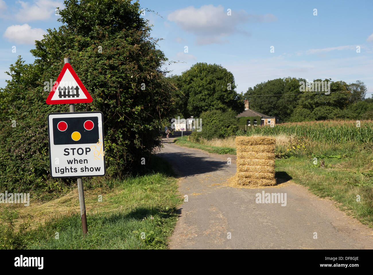 Straw bale obstructing road Fen Road Milton Stock Photo - Alamy