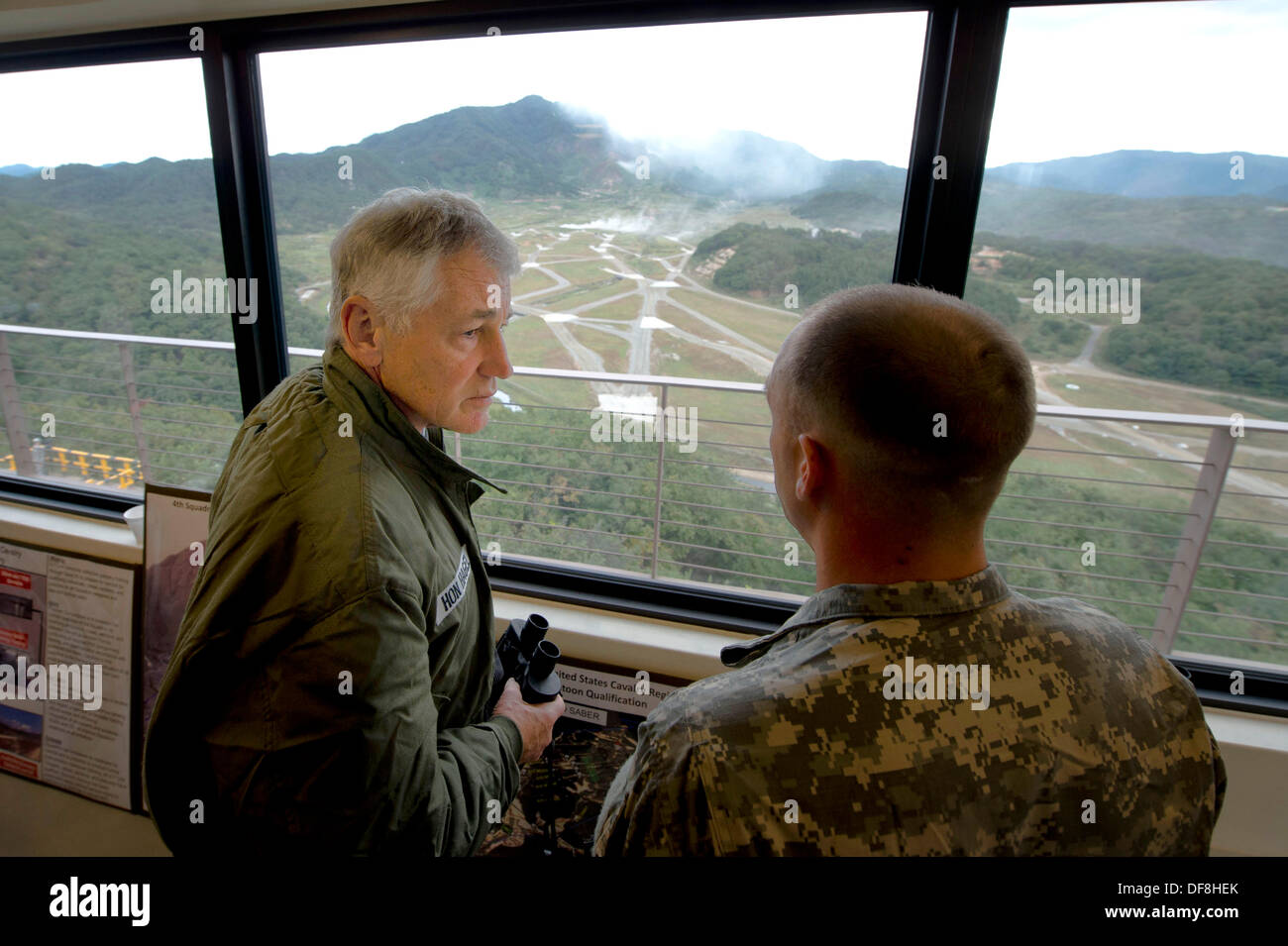 US Secretary of Defense Chuck Hagel observes live fire gunnery training ...