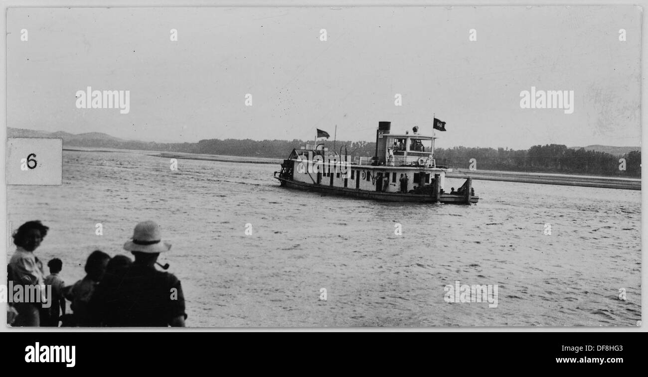 This photograph features a stern-wheel ferry navigating the Missouri ...