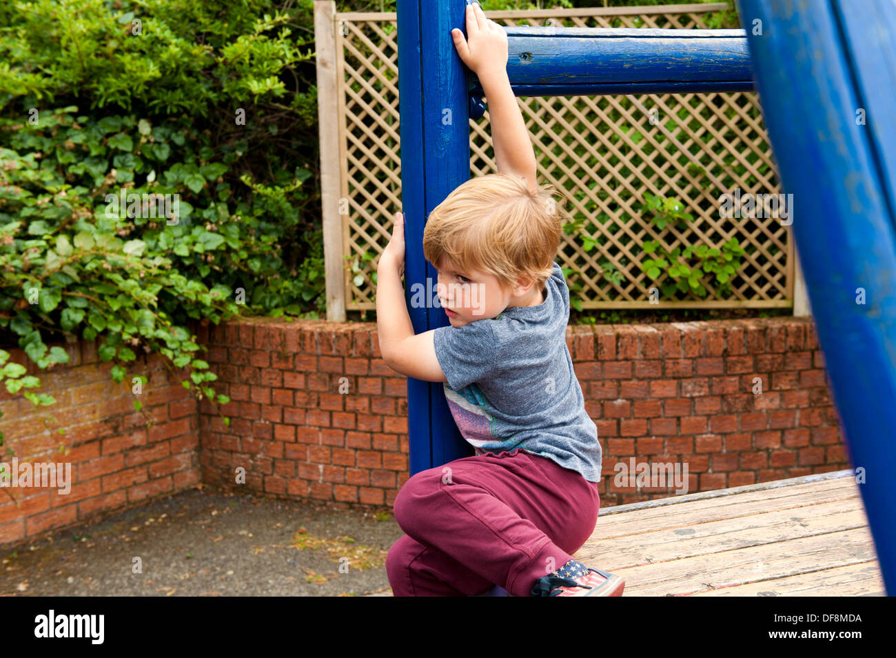 boy on climbing frame at play park Stock Photo - Alamy