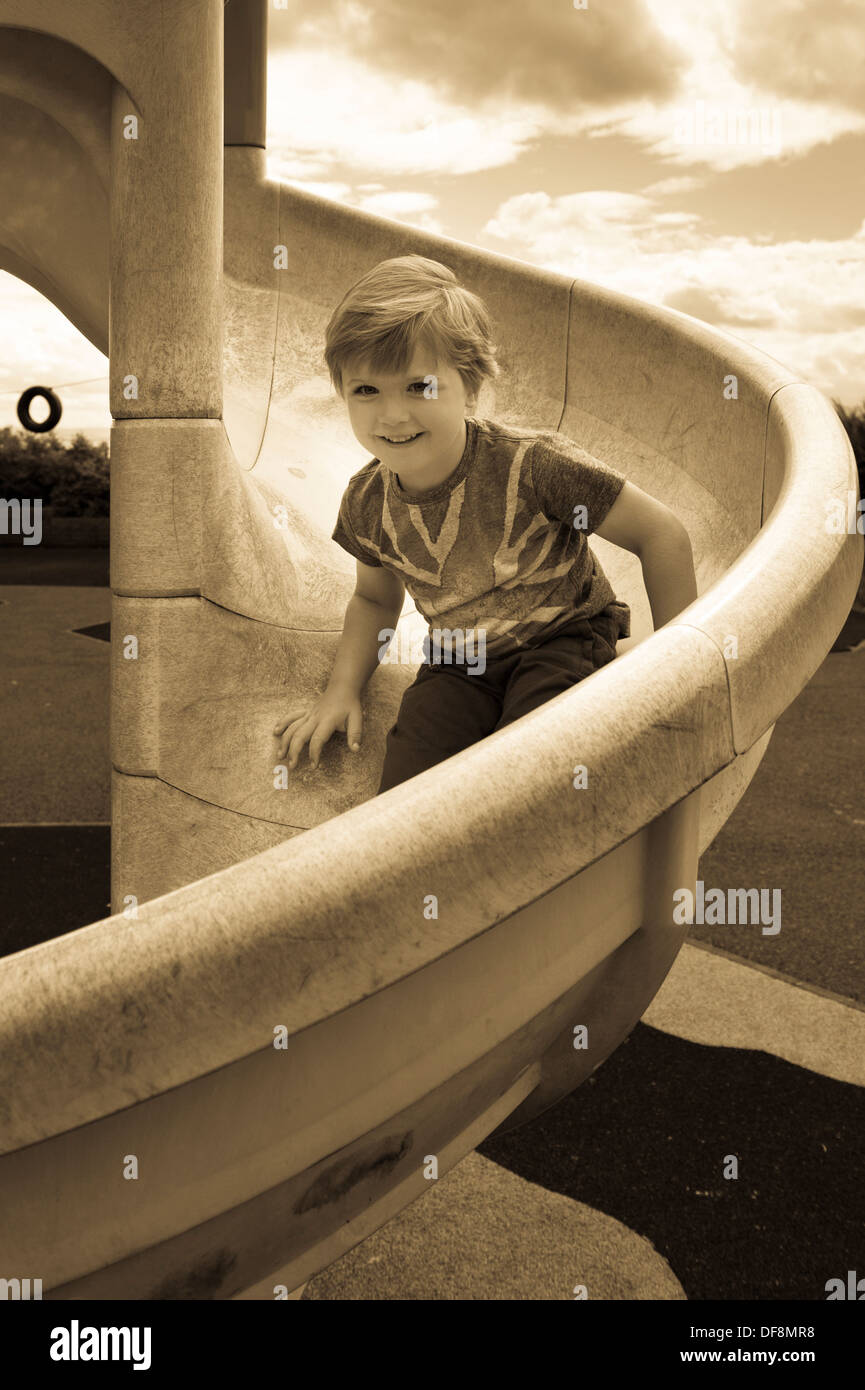 boy on slide, play park chute black and white Stock Photo - Alamy