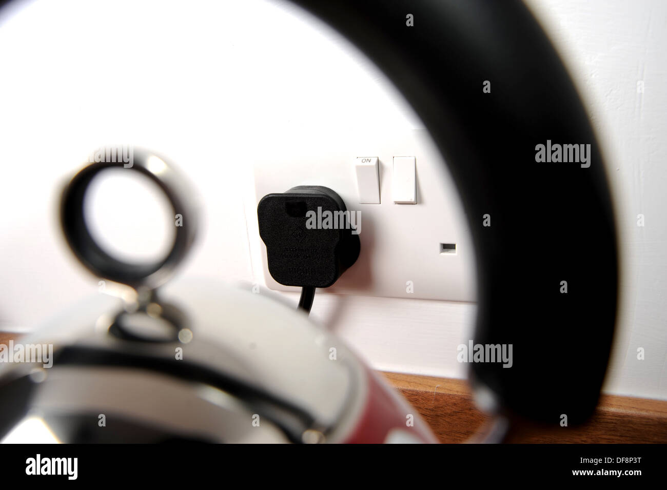 Electric plug socket viewed through kettle handle in kitchen Stock ...