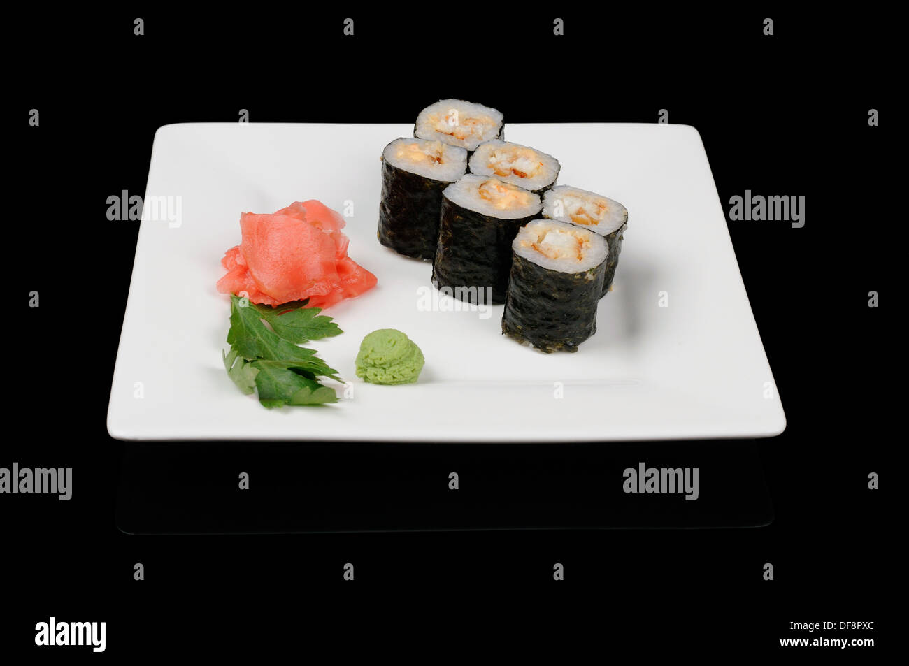 Six rolls on white rectangular plate on black background Stock Photo ...