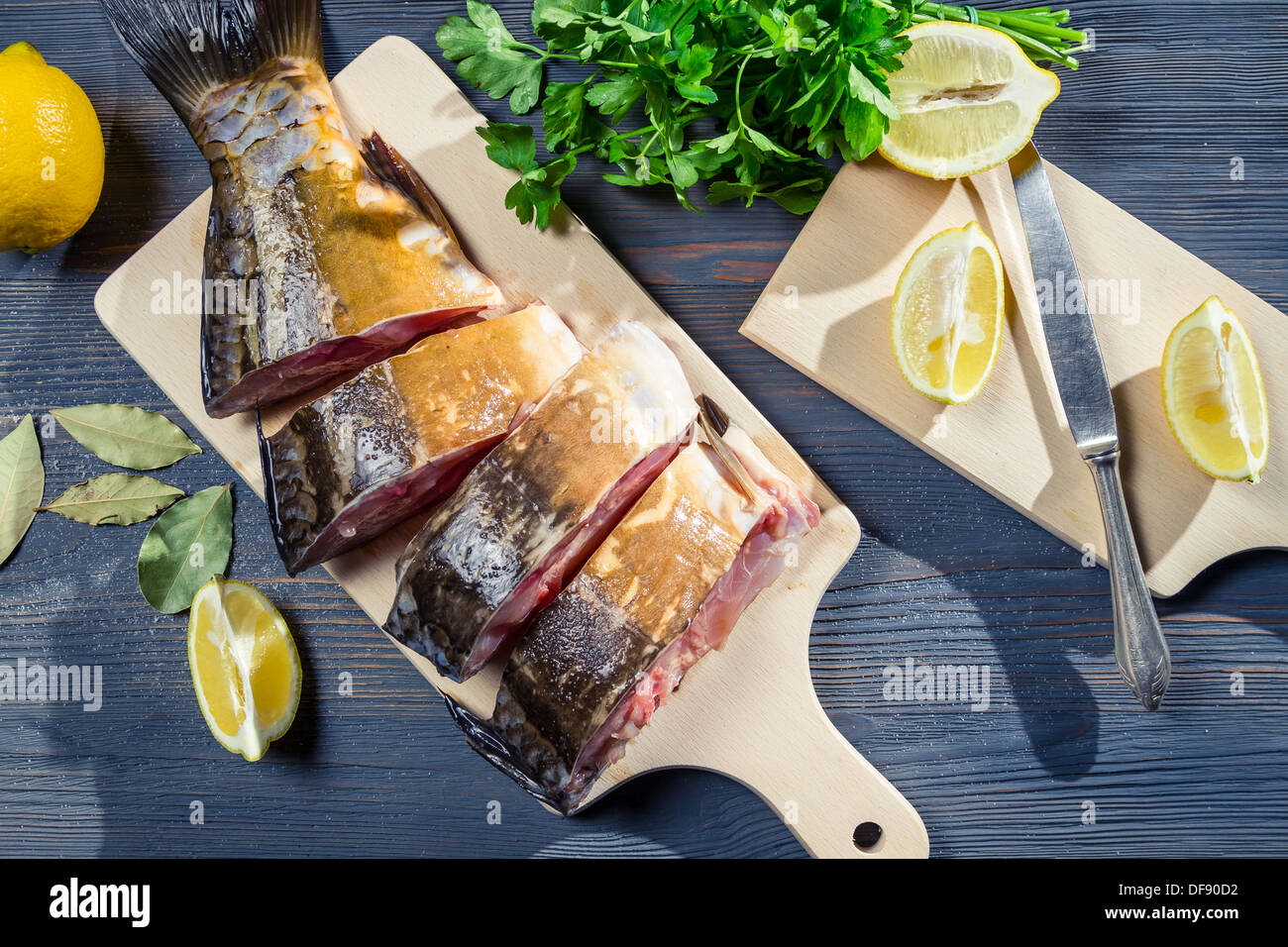 Ingredients and the fresh fish before frying on blue table Stock Photo ...