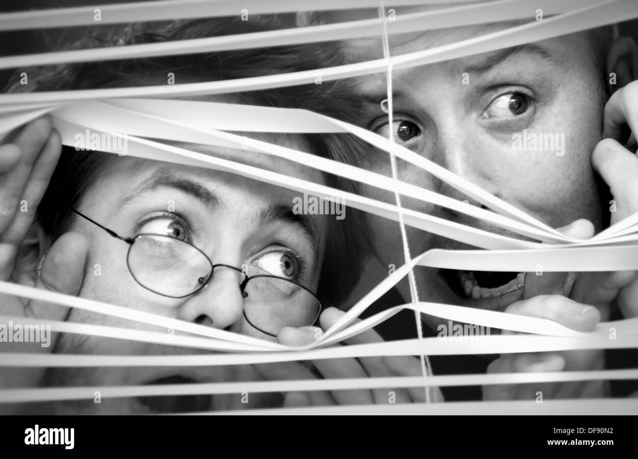 Humor, two scared men in window Stock Photo - Alamy