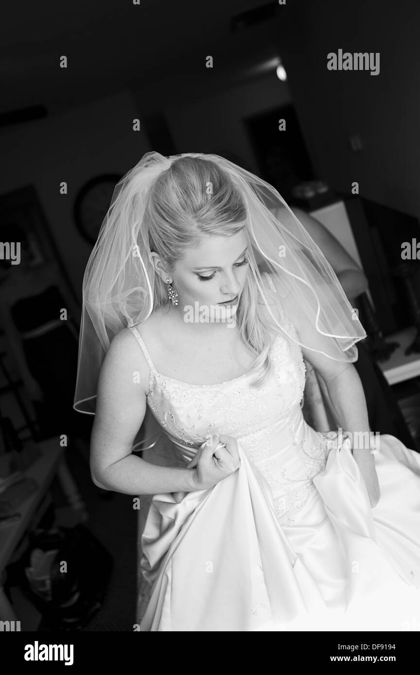 Woman holding up dress Black and White Stock Photos & Images - Alamy