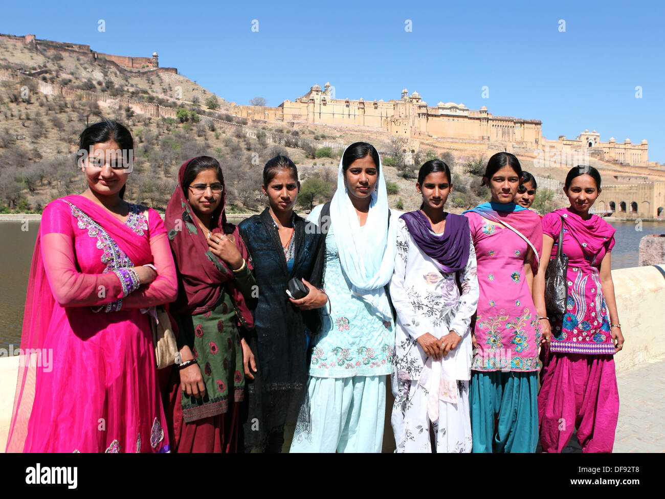 Group of female pilgrims pose for a photo near the Amber Fortress in ...