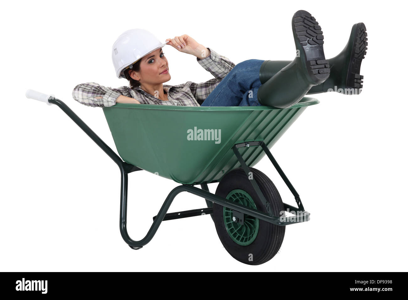 Woman laying in wheelbarrow Stock Photo - Alamy