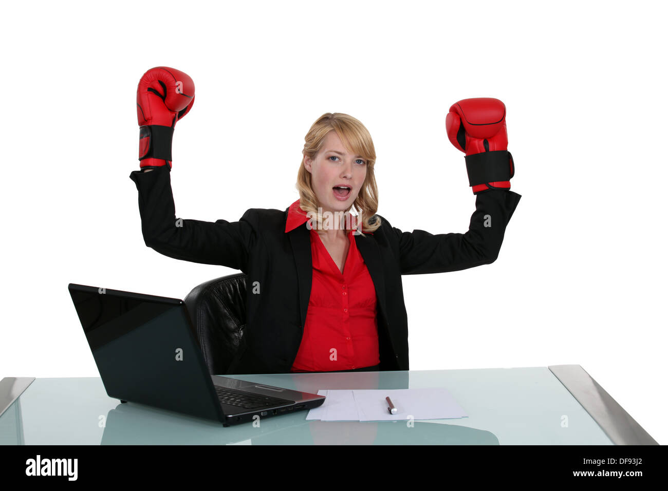 Woman at her desk with boxing gloves Stock Photo - Alamy