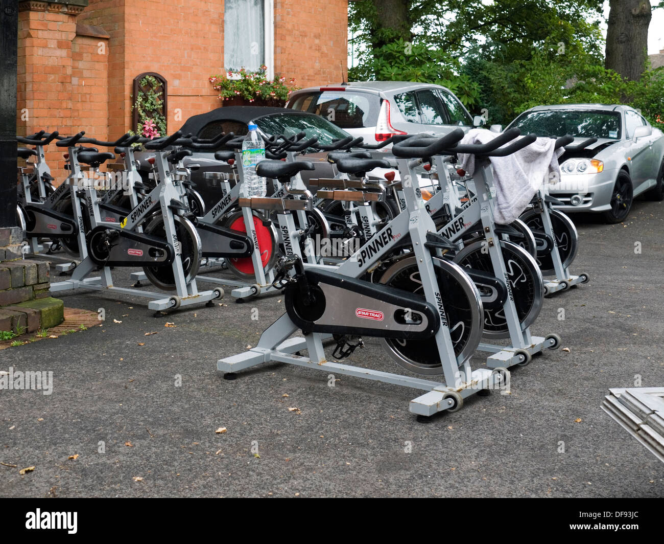 collection of keep fit gym cycles in a line awaiting loading onto a van ...