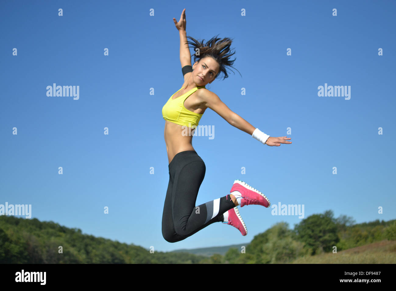 beautiful young woman jumping Stock Photo - Alamy