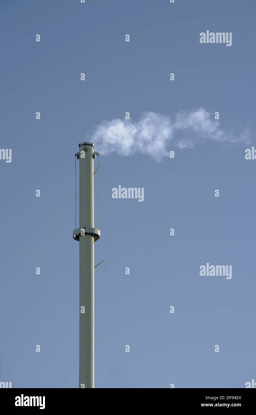 Smokestack in front of gray background. Vertical Stock Photo - Alamy