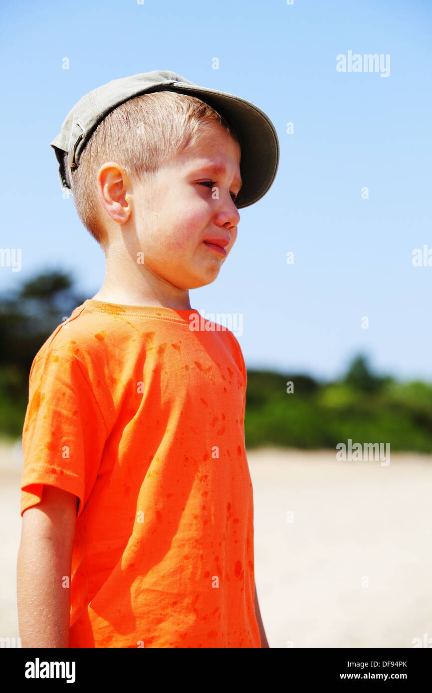 Sad child. Portrait of crying unhappy little boy outdoor Stock Photo ...
