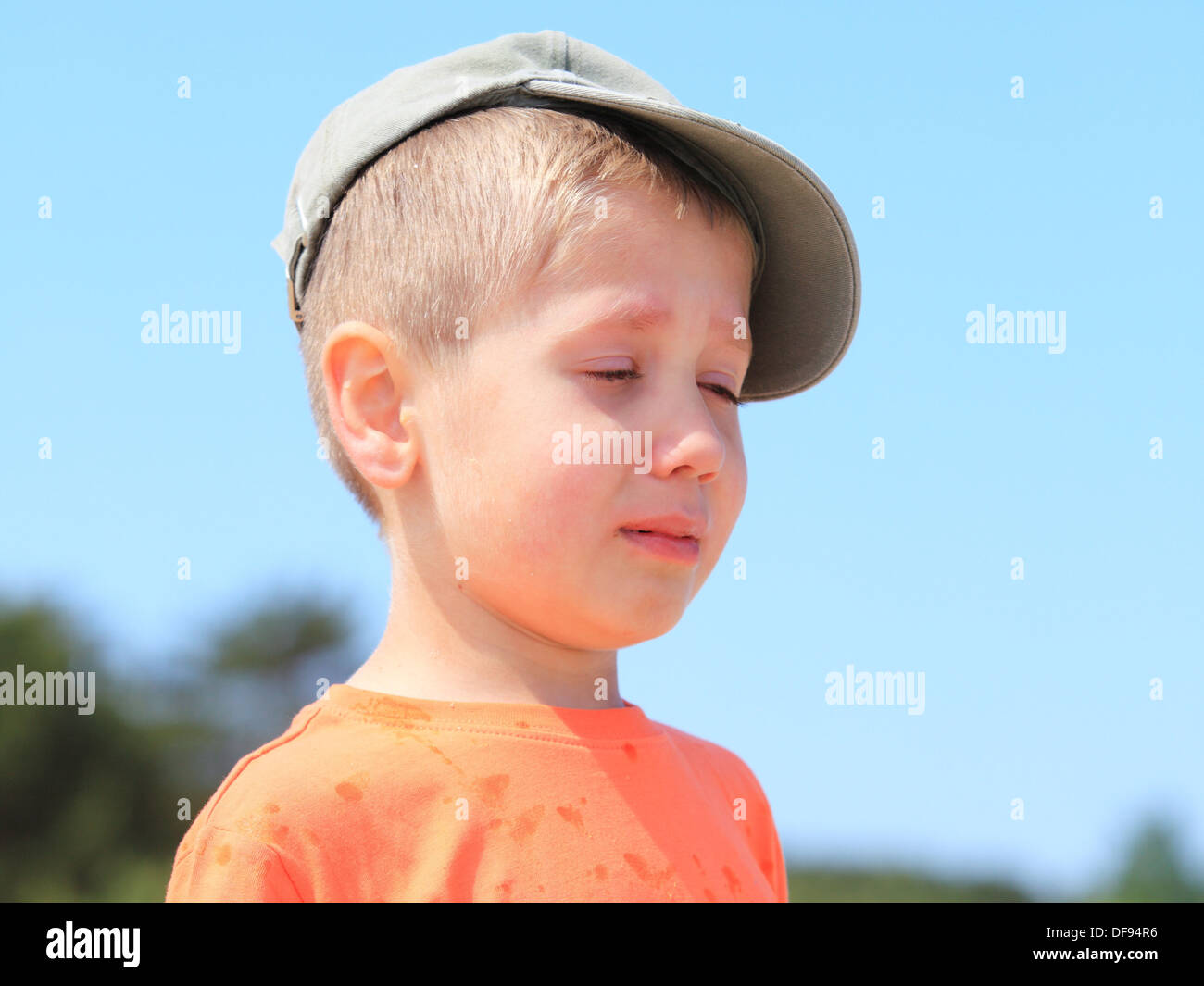 Sad child. Portrait of crying unhappy little boy outdoor Stock Photo ...
