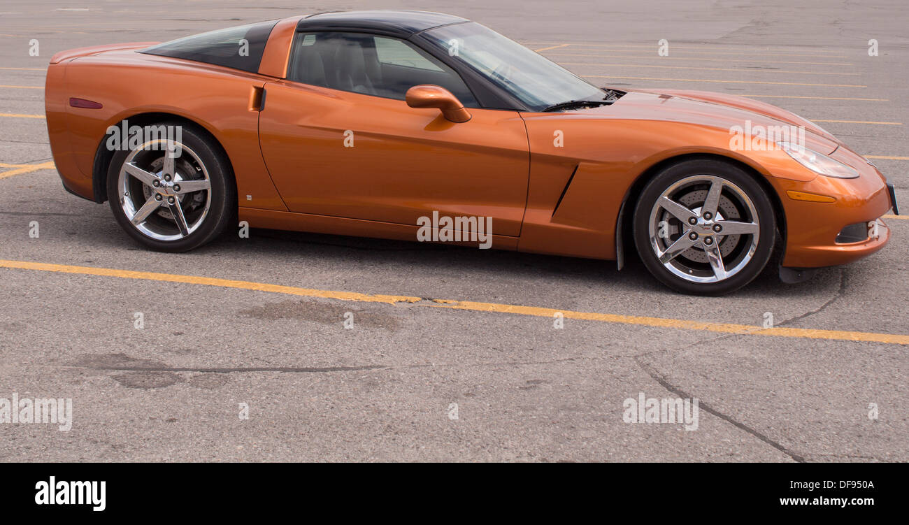 Side view of a Rust coloured Corvette in parking lot Stock Photo - Alamy
