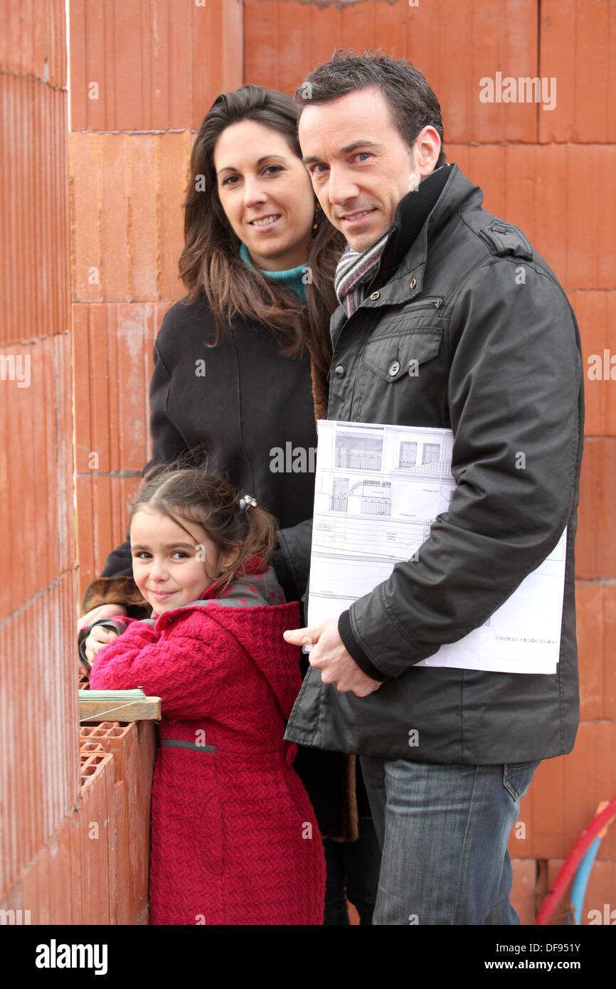 Family visiting site of future home Stock Photo - Alamy