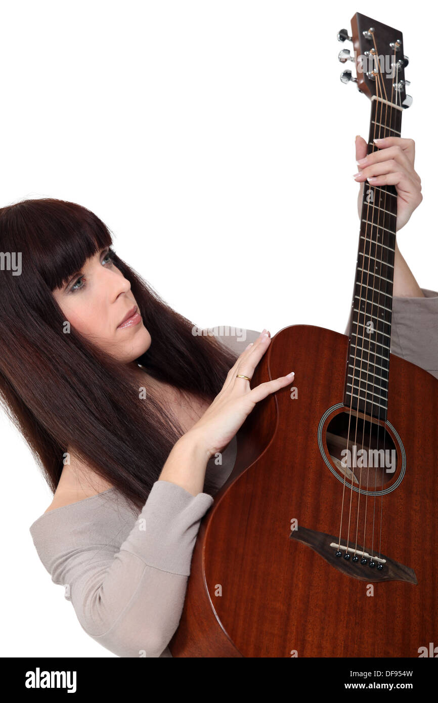 Woman with an acoustic guitar Stock Photo - Alamy