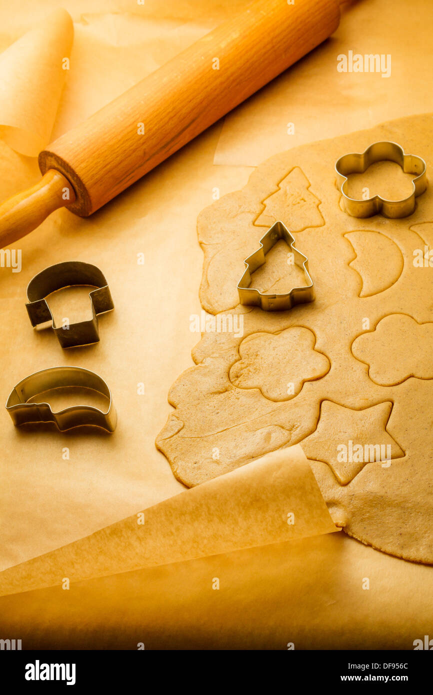 Cutting of different shapes of gingerbread cookies Stock Photo - Alamy