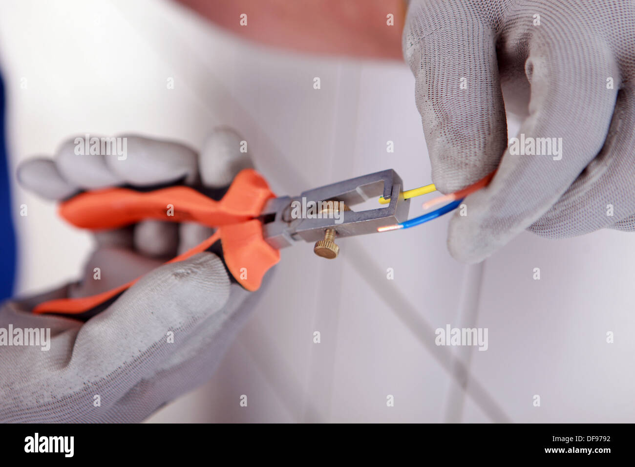 Electrician clipping wire Stock Photo - Alamy