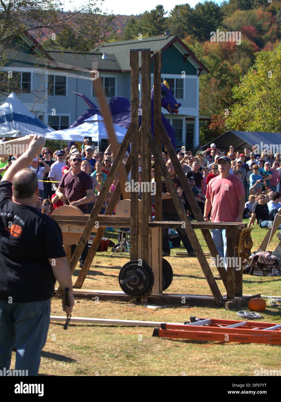 Crowd looks on as team gets ready to launch pumpkin from trebuchet at ...
