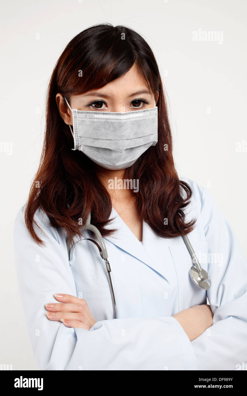 Female doctor wears mask Stock Photo - Alamy