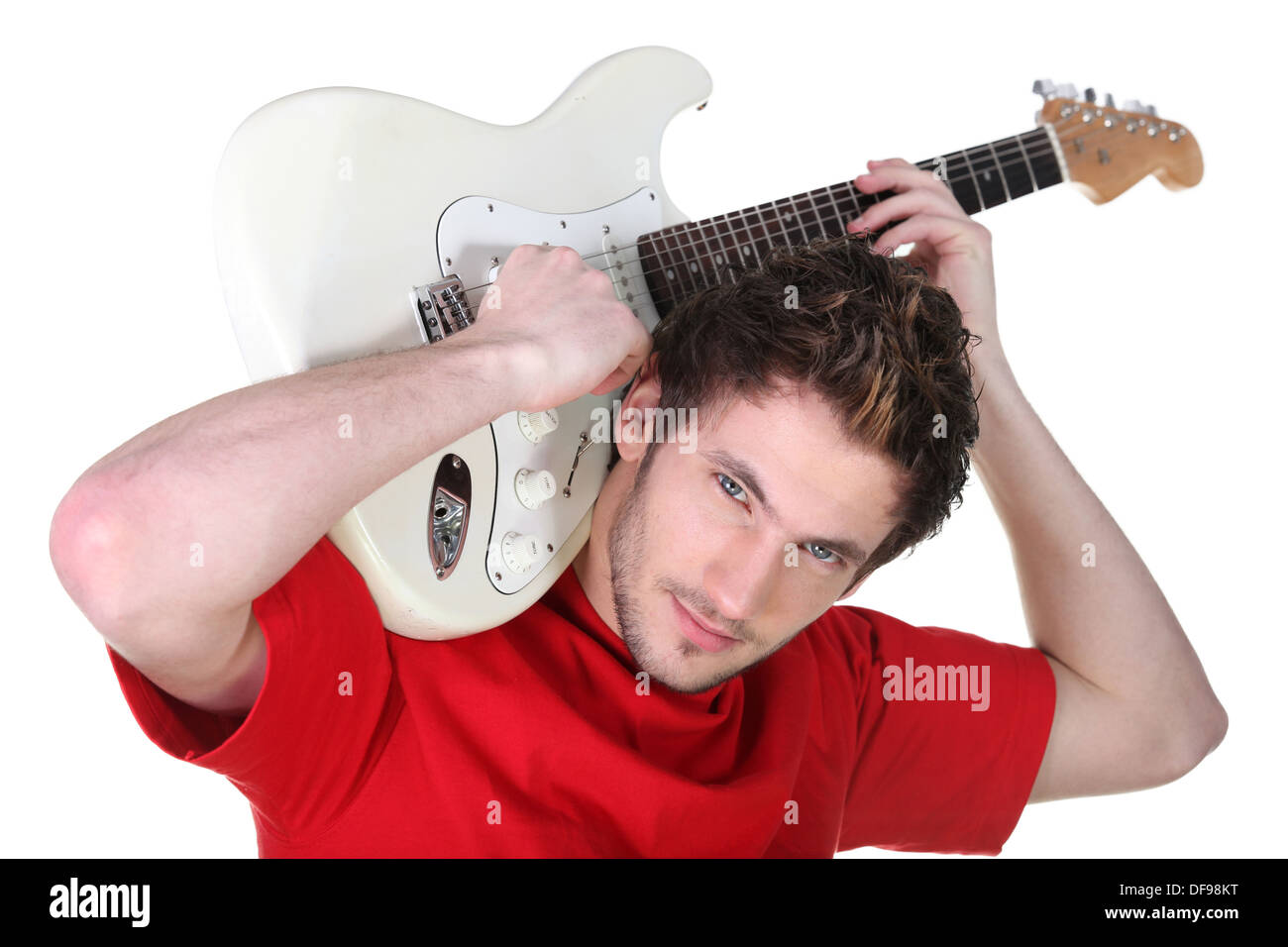 Rocker playing the electric guitar Stock Photo - Alamy