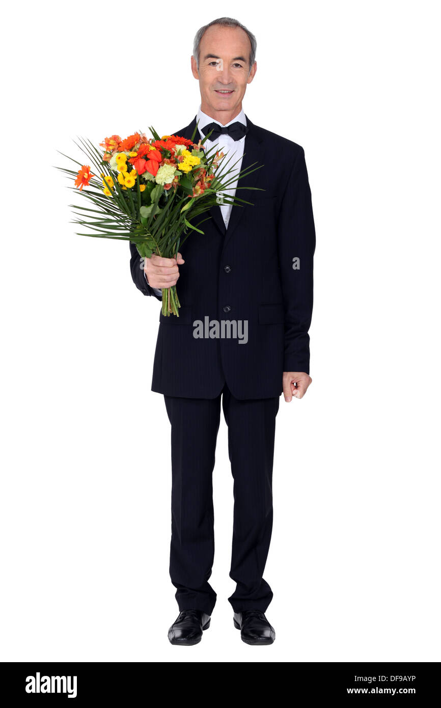 Man with a bouquet of flowers Stock Photo - Alamy