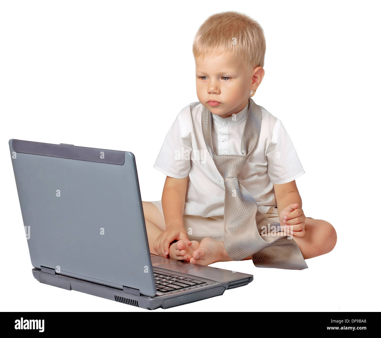 The little boy, the European child plays, is trained on the computer ...