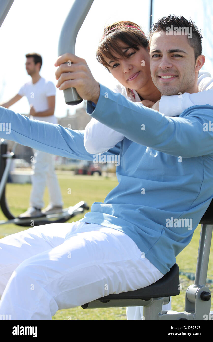 People using outdoor gym equipment Stock Photo - Alamy