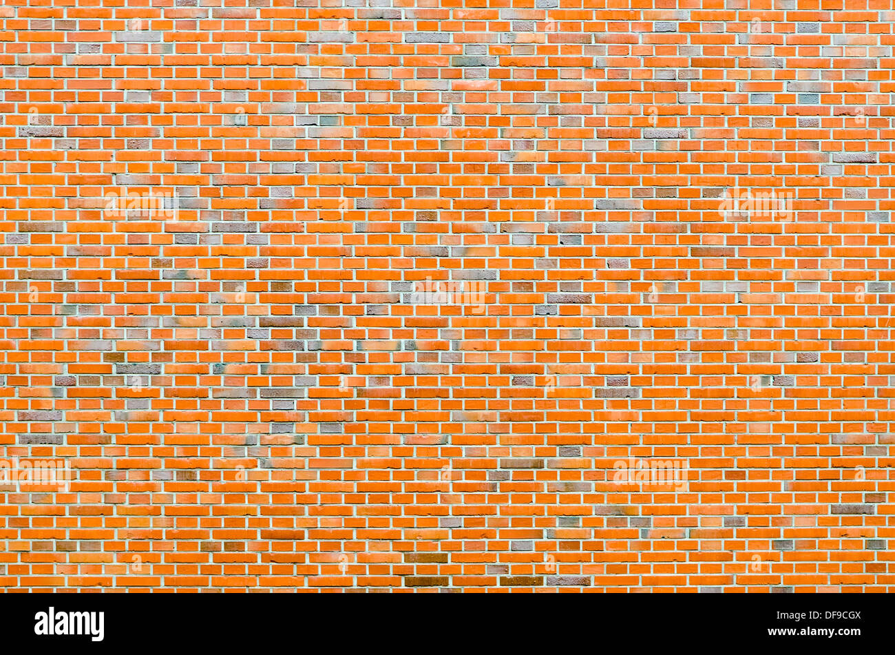 reddish brick stone wall as a texture background Stock Photo - Alamy