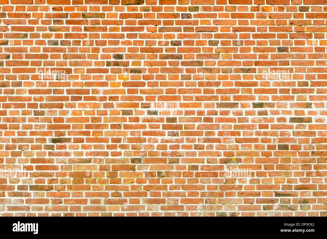 reddish brick stone wall as a texture background Stock Photo - Alamy