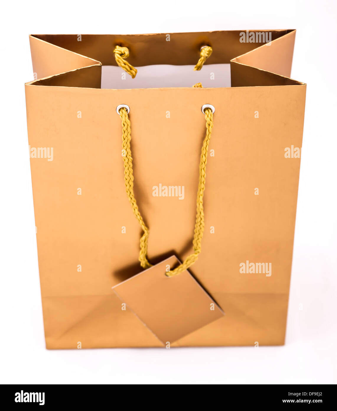 A gold gift bag isolated Stock Photo - Alamy
