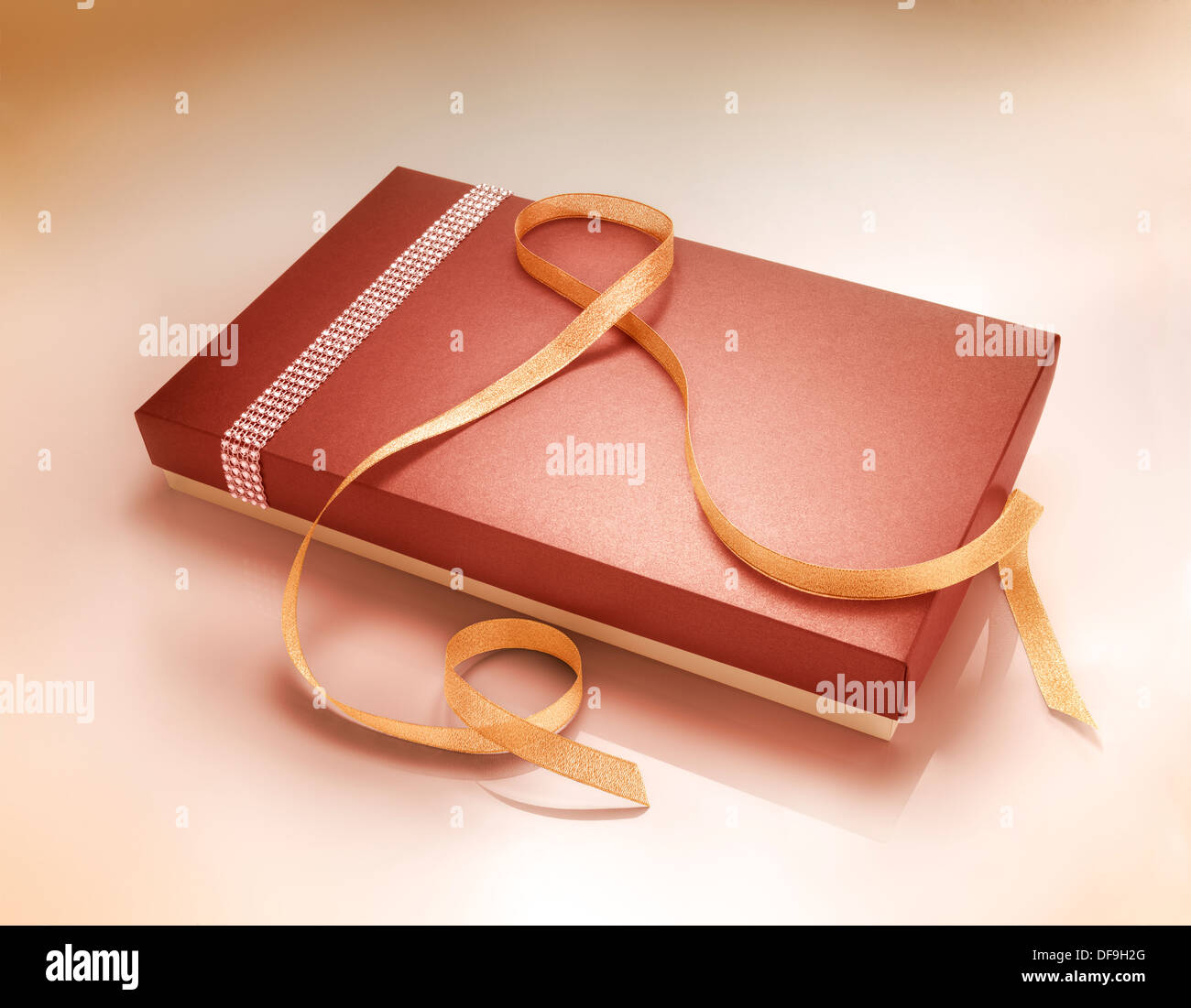 Red color gift box with loop. Christmas concept Stock Photo - Alamy